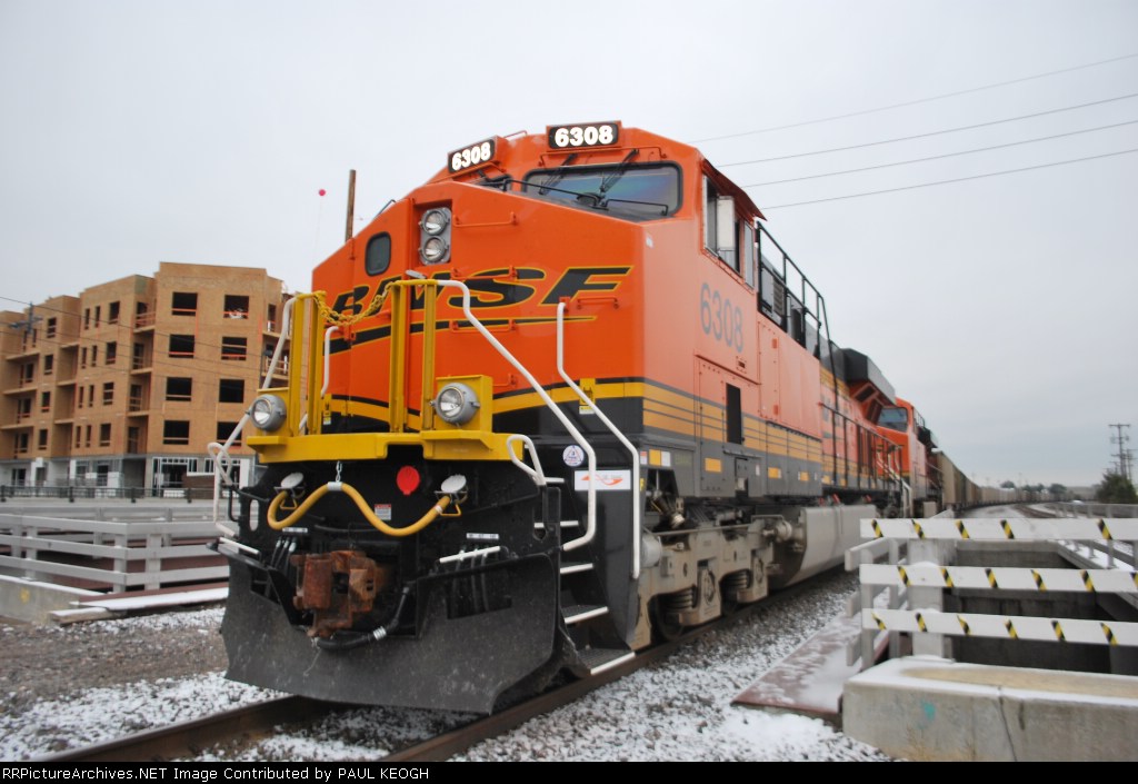 BNSF 6308 waits to roll north leading a empty coal train.